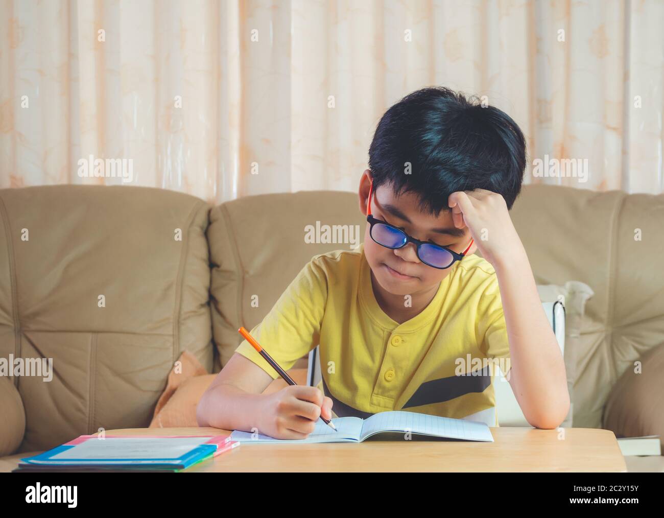 Boy doing school homework from mathematics hi-res stock photography and ...