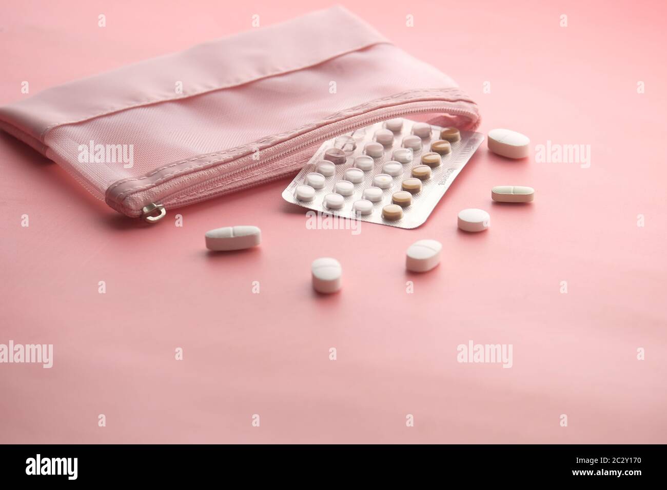 birth control pills on pink background with copy space Stock Photo - Alamy