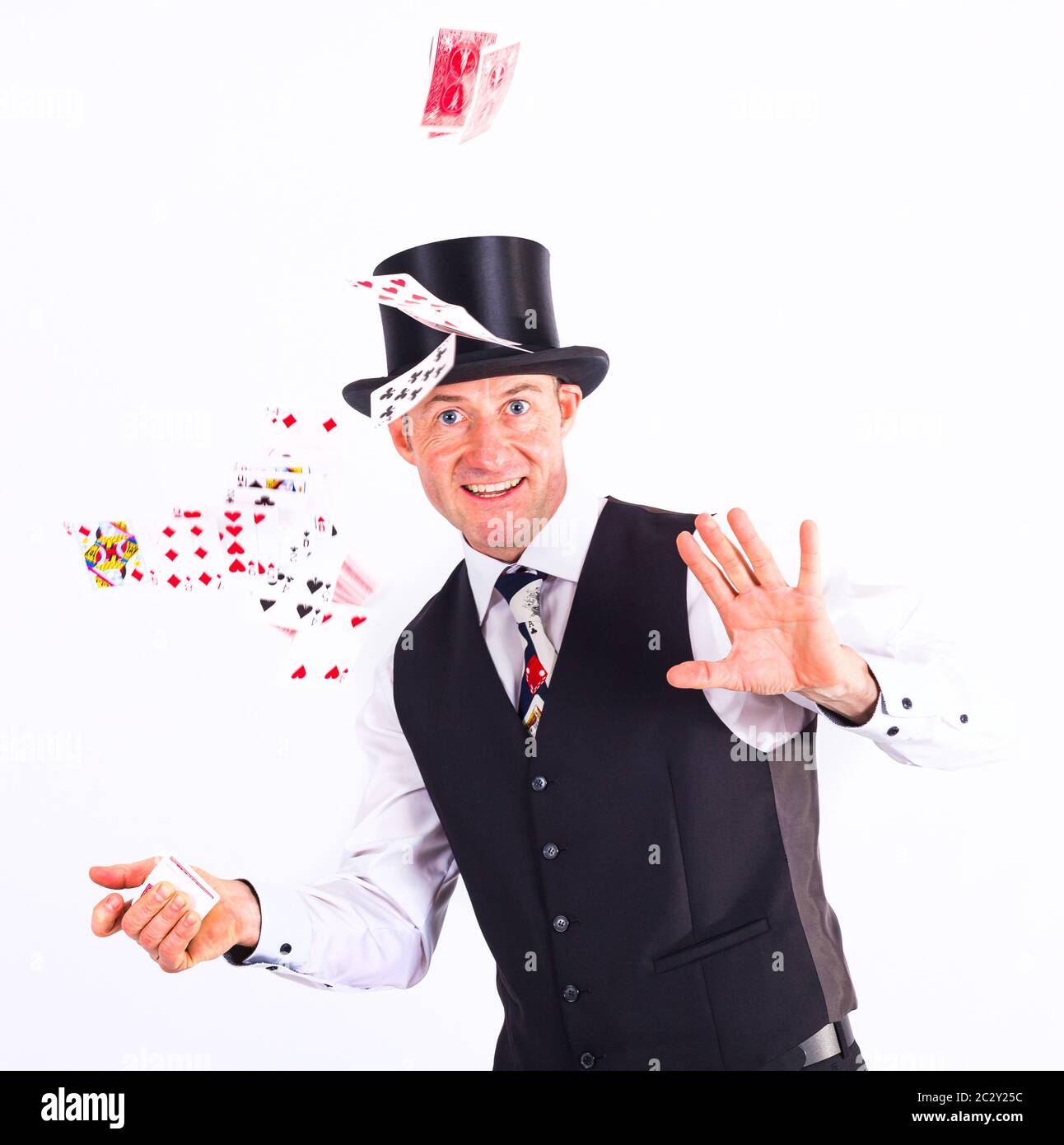magician shows a trick with cards Stock Photo - Alamy