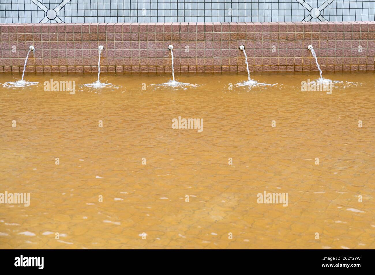 Yellow Water Fountain Pond in Hong Kong Stock Photo - Alamy