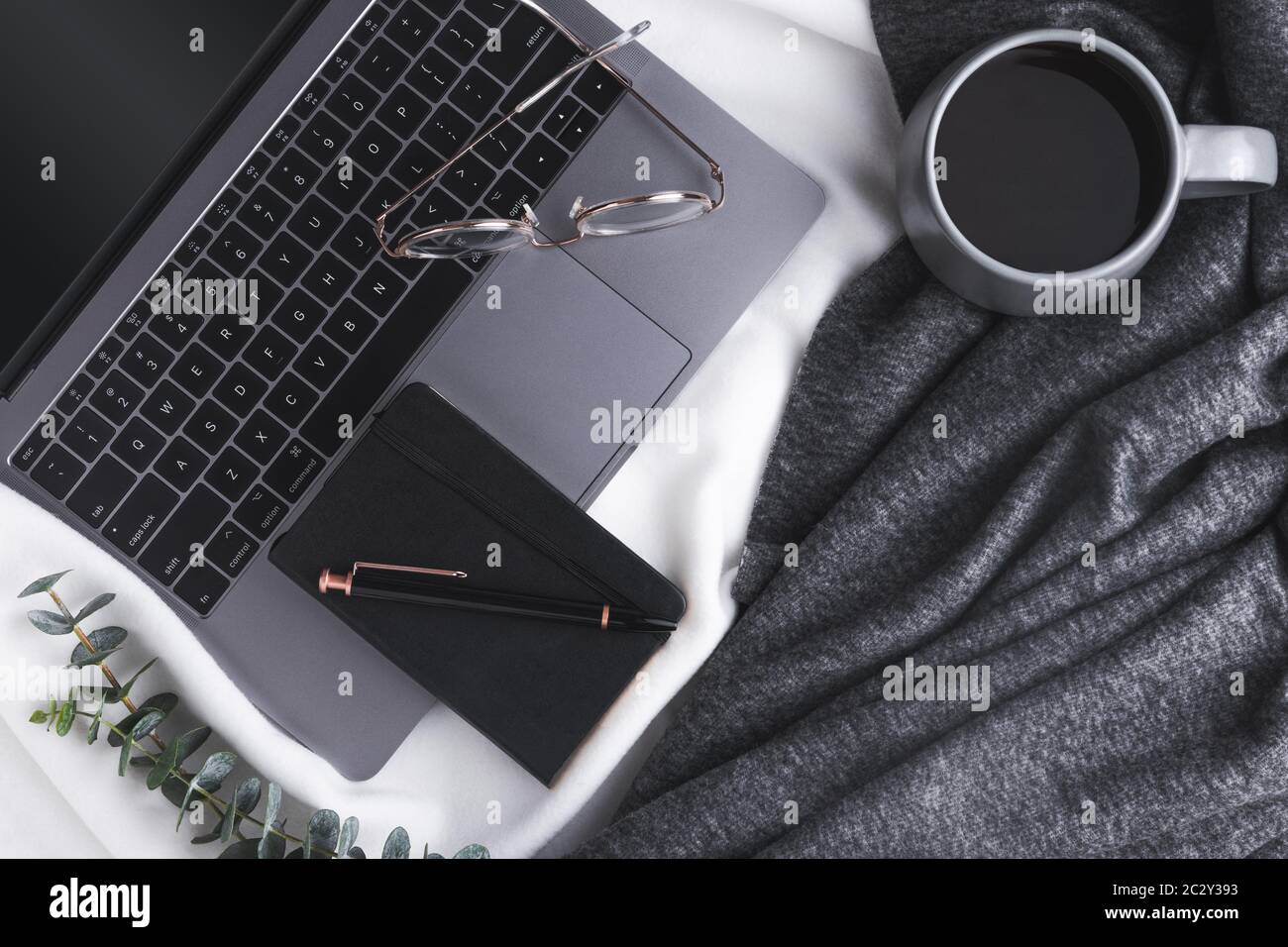Electronics layout in a white and gray bed flat lay Stock Photo - Alamy