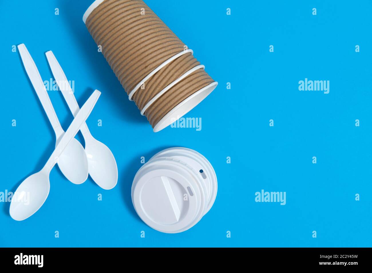reusable cups on a blue background with plastic caps and spoons Stock ...