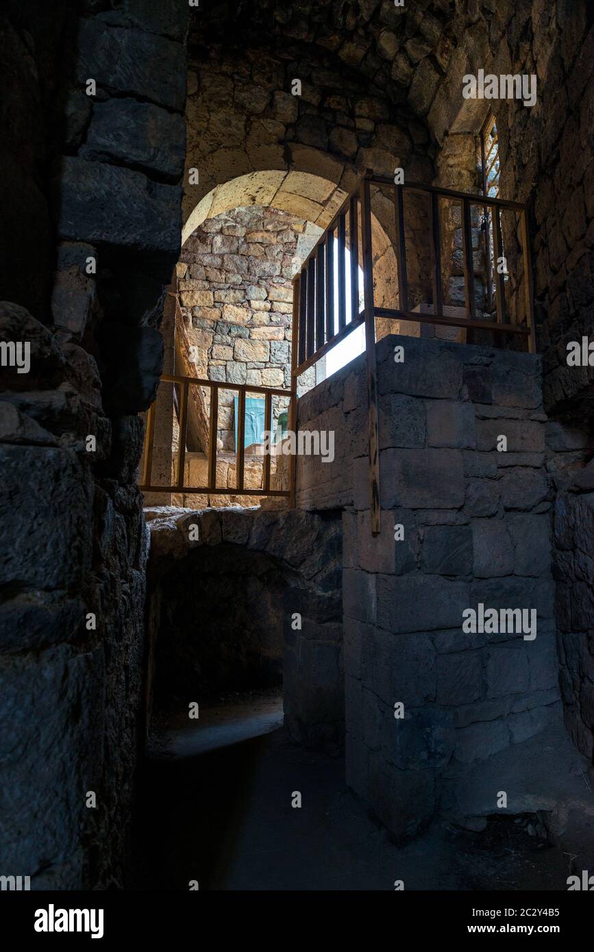 Walk around Tatev Monastery, interior - old stone walls and arches ...