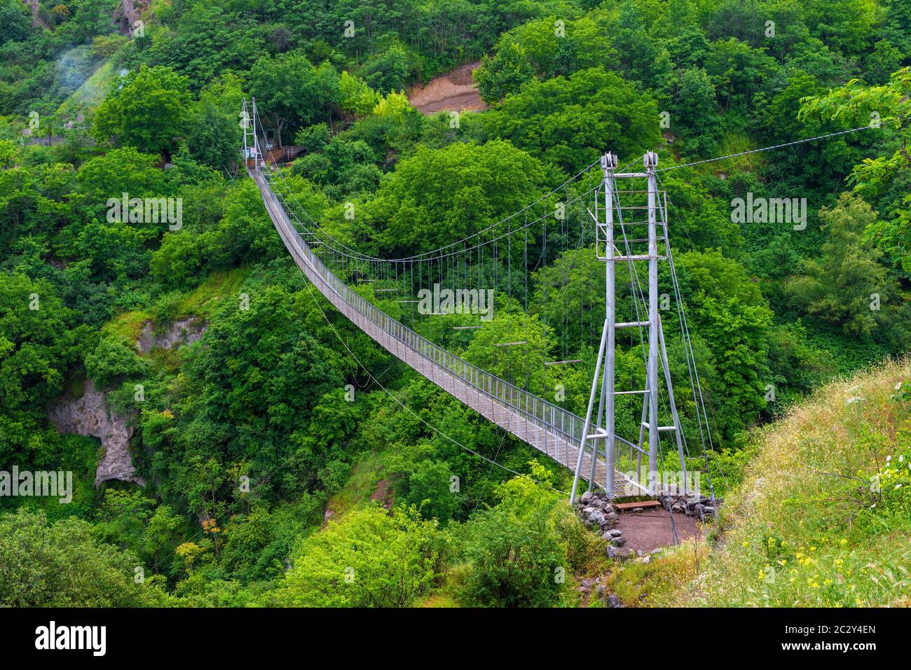 Suspension bridge over the gorge in the mountains of Armenia, a ...