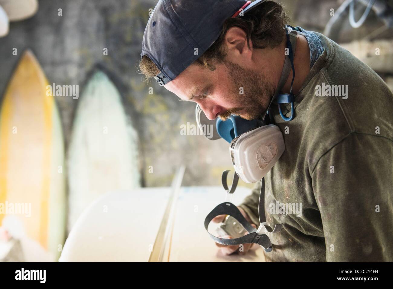 Surfboard Shaper creating a new design Stock Photo - Alamy