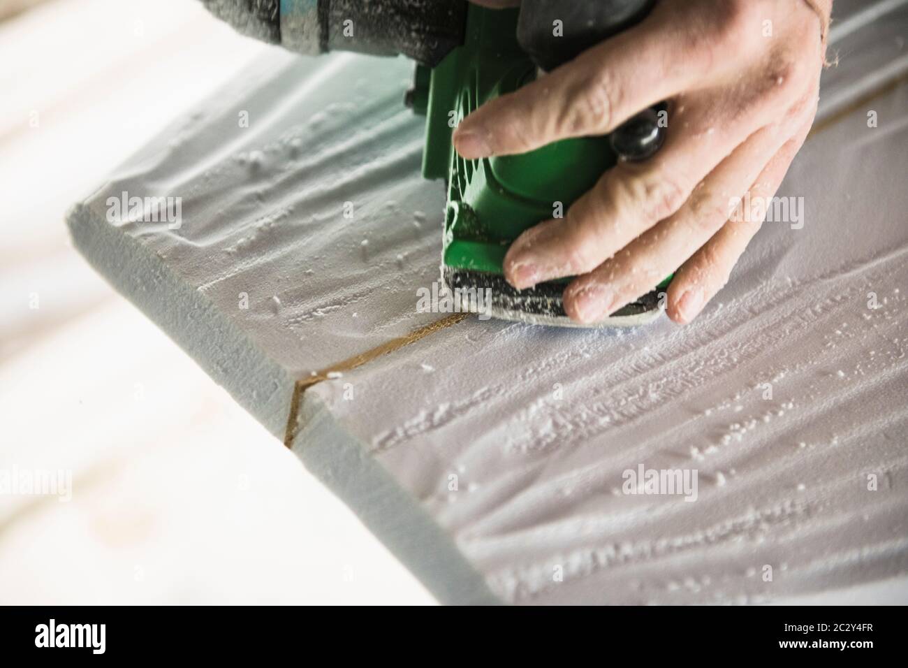 Surfboard Shaper planing a new design Stock Photo - Alamy