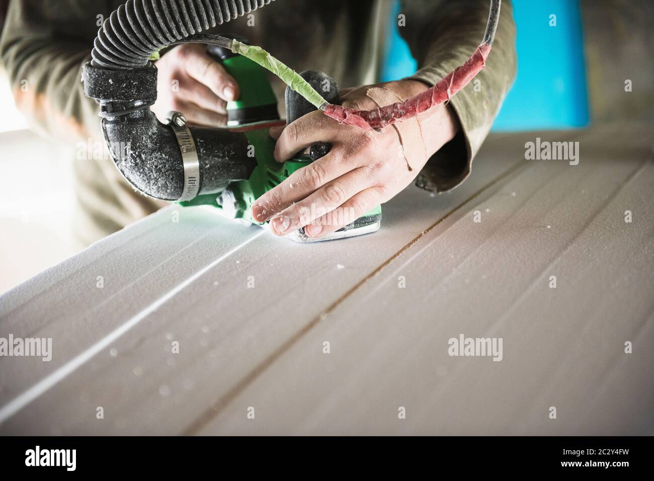 Surfboard Shaper planing a new design Stock Photo - Alamy