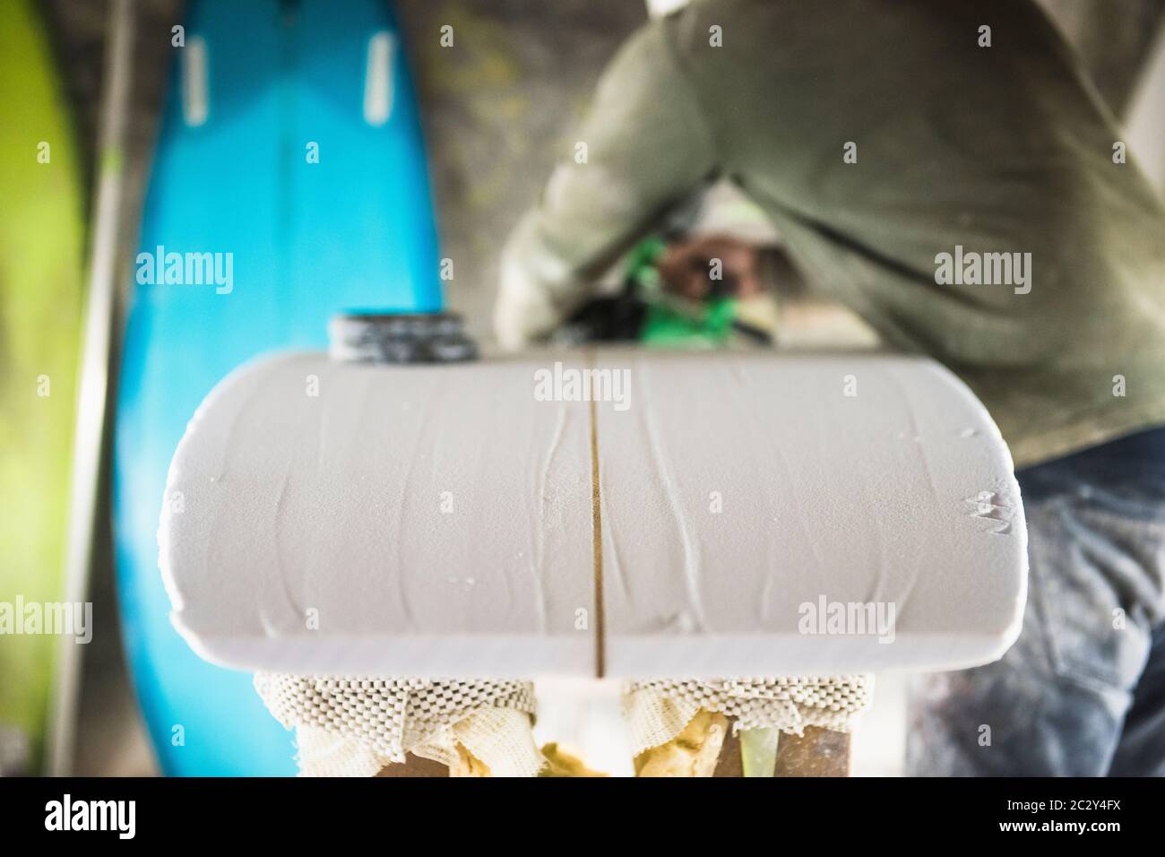 Surfboard Shaper planing a new design Stock Photo - Alamy