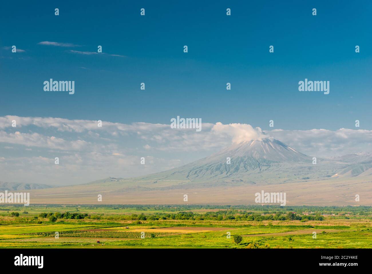 Mountain Small Ararat behind a cloud and green field, beautiful ...