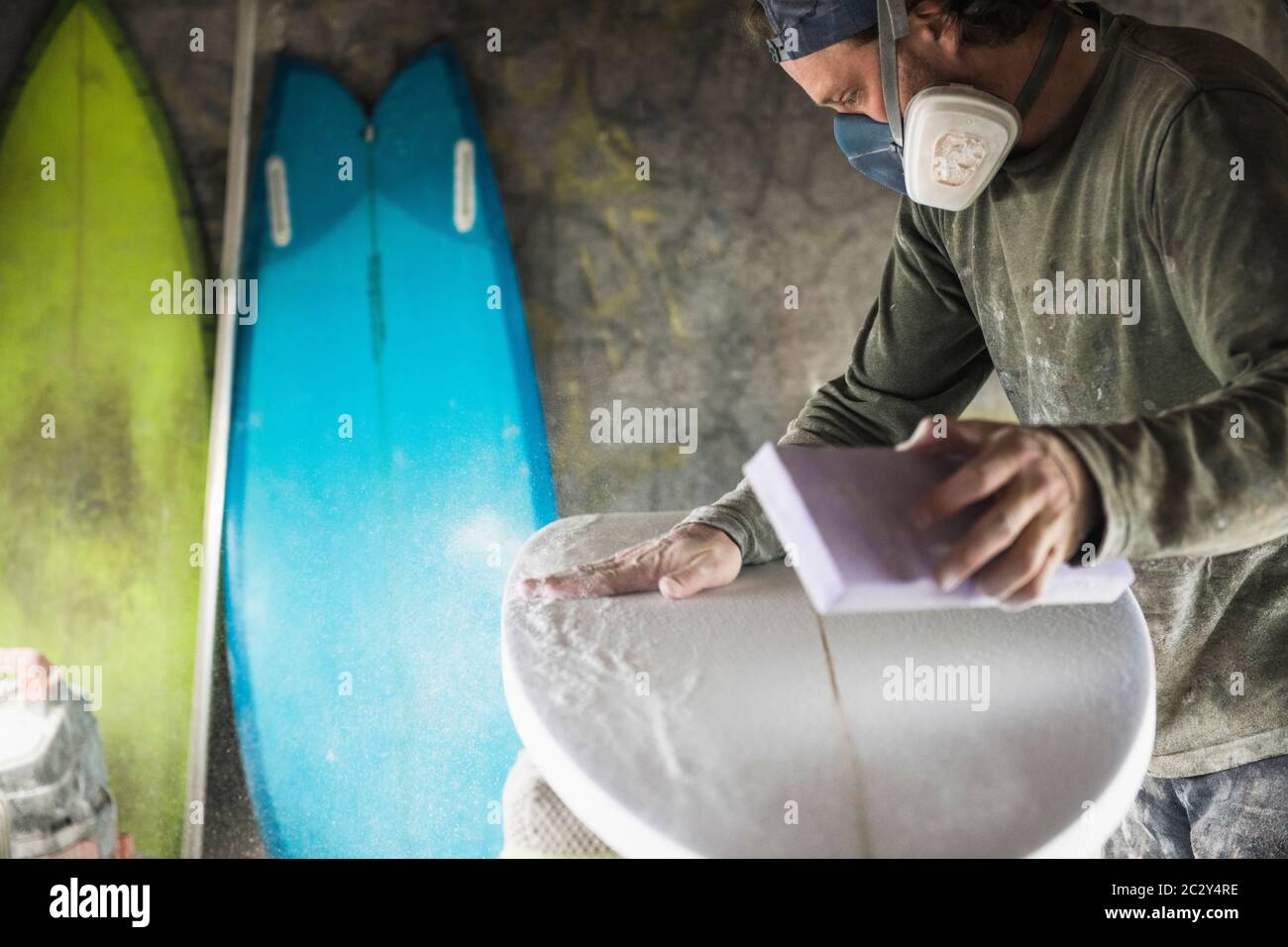 Surfboard Shaper refining a new design Stock Photo - Alamy