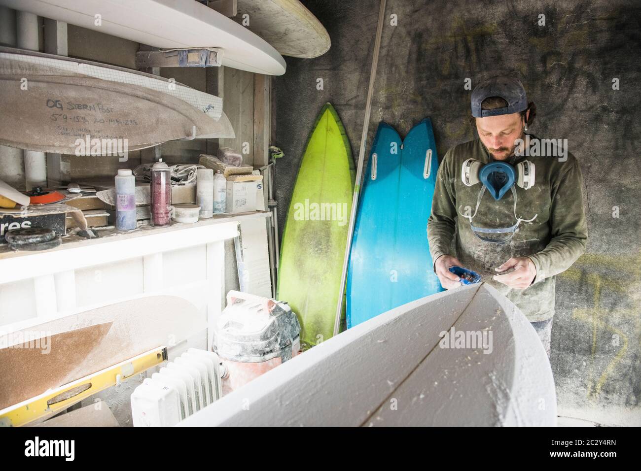Surfboard Shaper refining a new design Stock Photo - Alamy