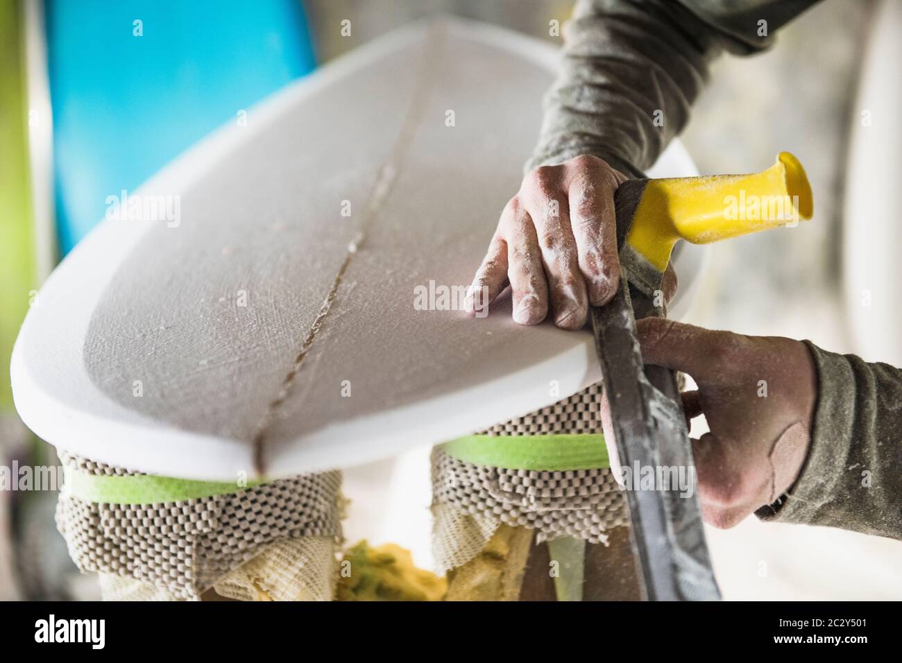 Surfboard Shaper refining a new design Stock Photo - Alamy