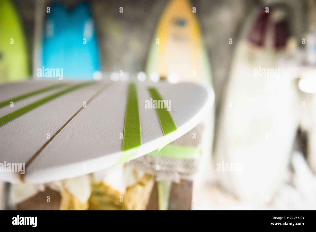 Surfboard Shaper refining a new design Stock Photo - Alamy