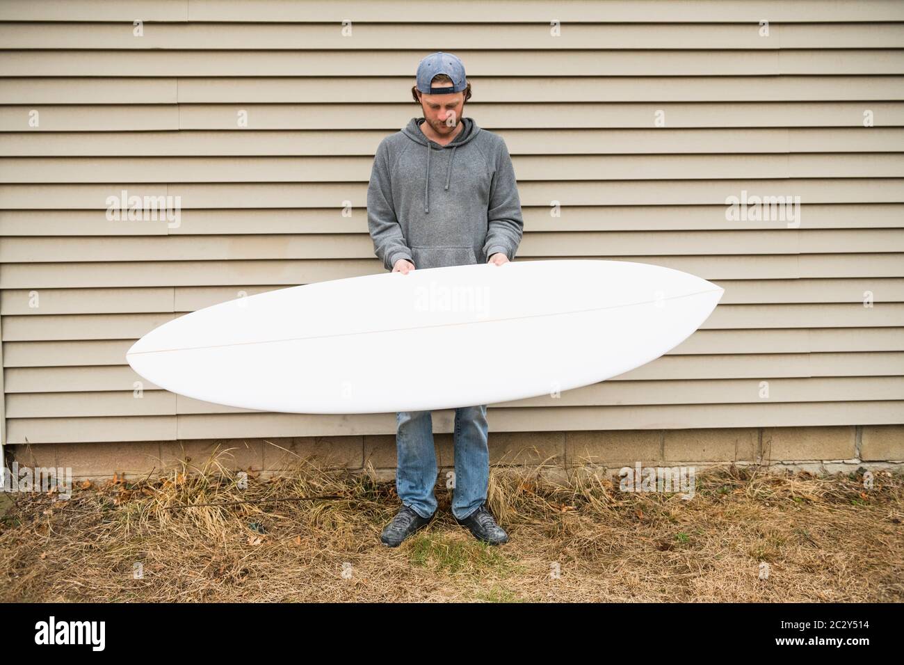 Surfboard Shaper refining a new design Stock Photo - Alamy