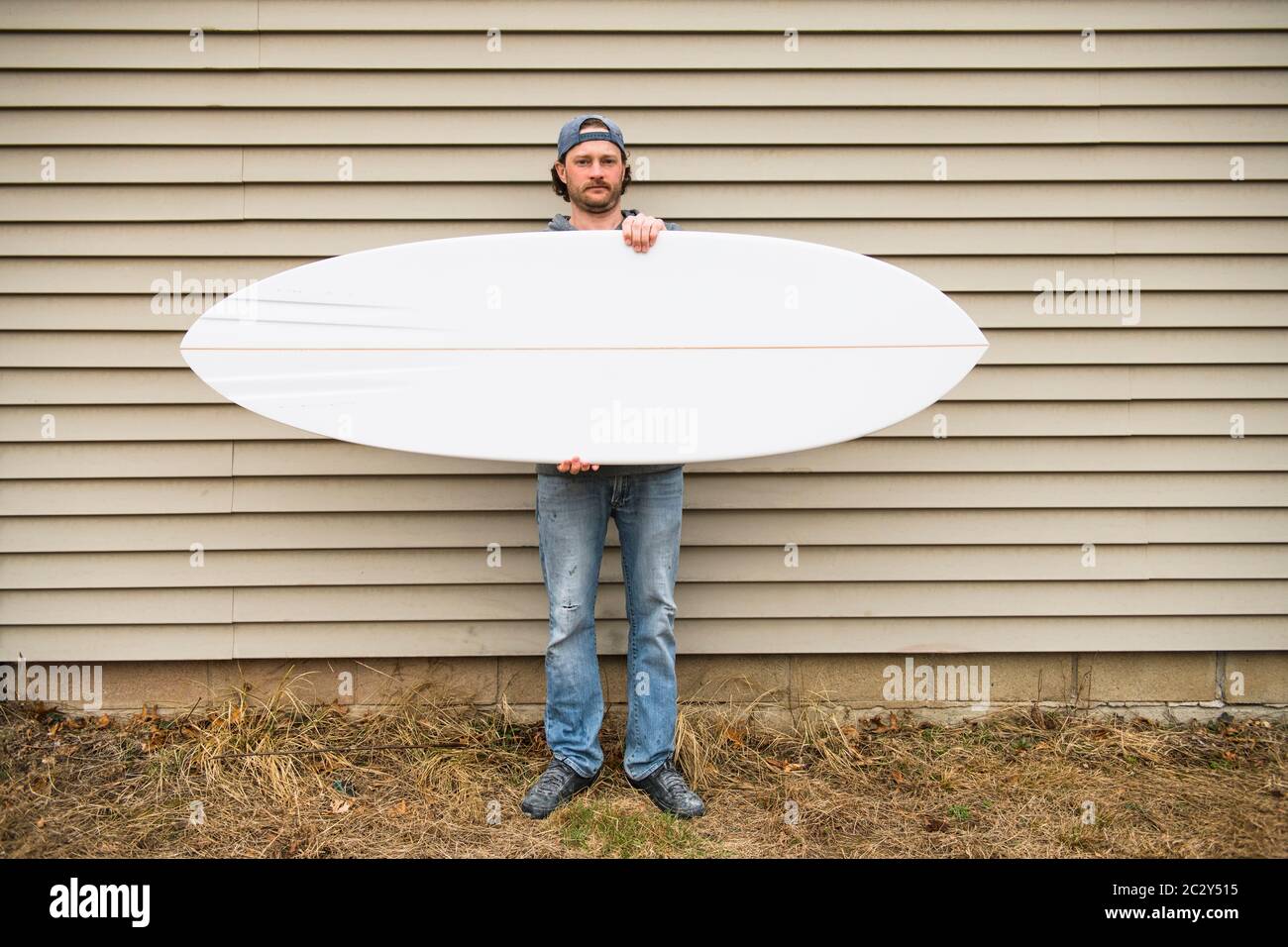 Surfboard Shaper refining a new design Stock Photo - Alamy