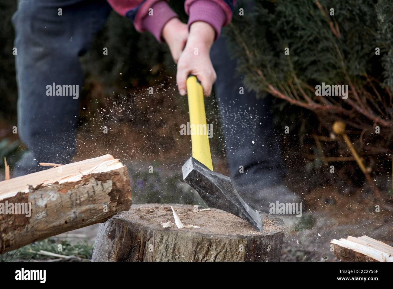 ax chopping wood for logs, village Stock Photo - Alamy