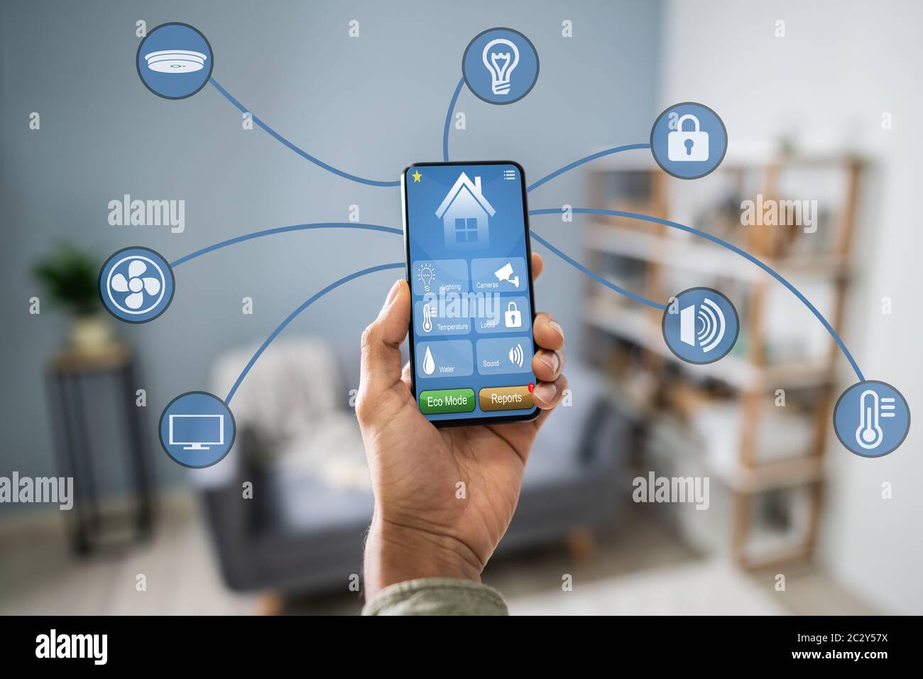 Man's Hand Using Home Control System On Cellphone With Various Icons ...