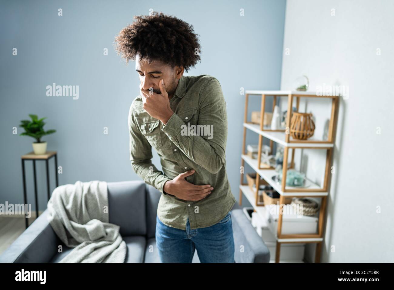African american man suffering stomach hi-res stock photography and ...