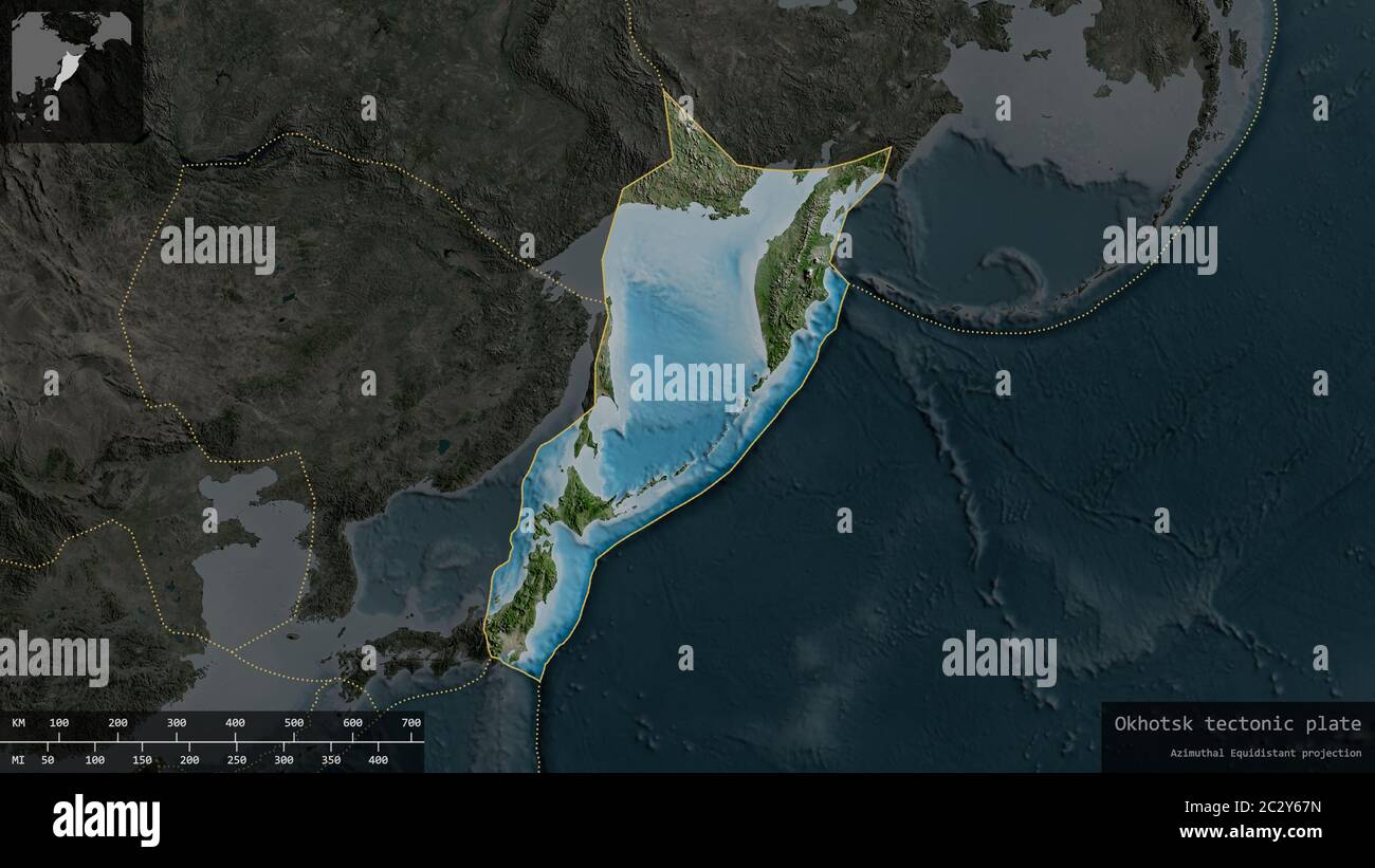 Okhotsk plate shape outlined on a darkened and desaturated background ...