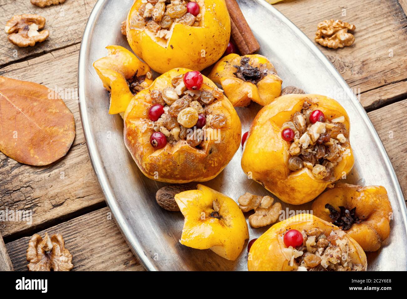 Quince stuffed with raisins and walnuts.Baked quince.Autumn food Stock ...