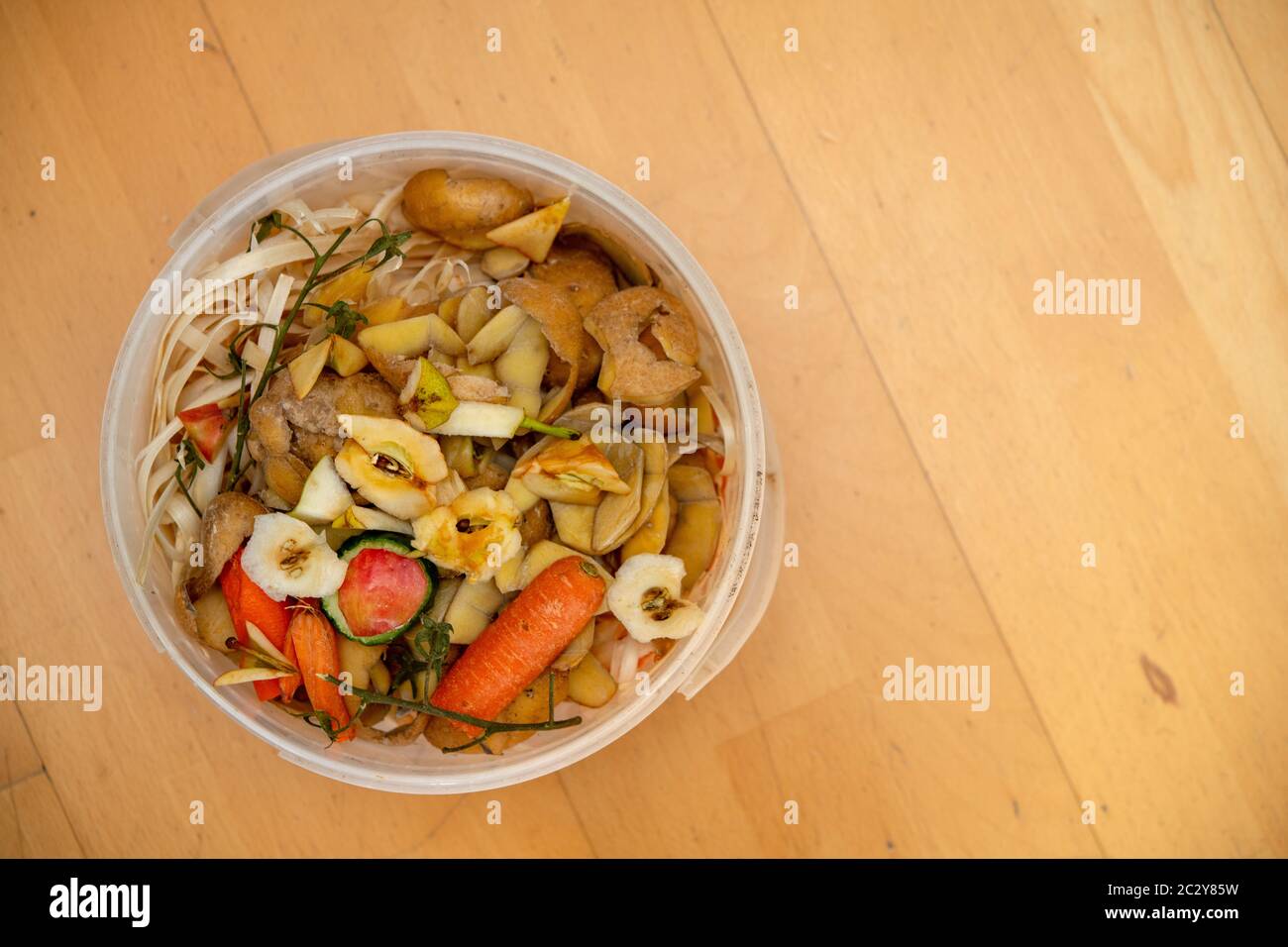 organic waste in bucket on wooden ground from top Stock Photo - Alamy