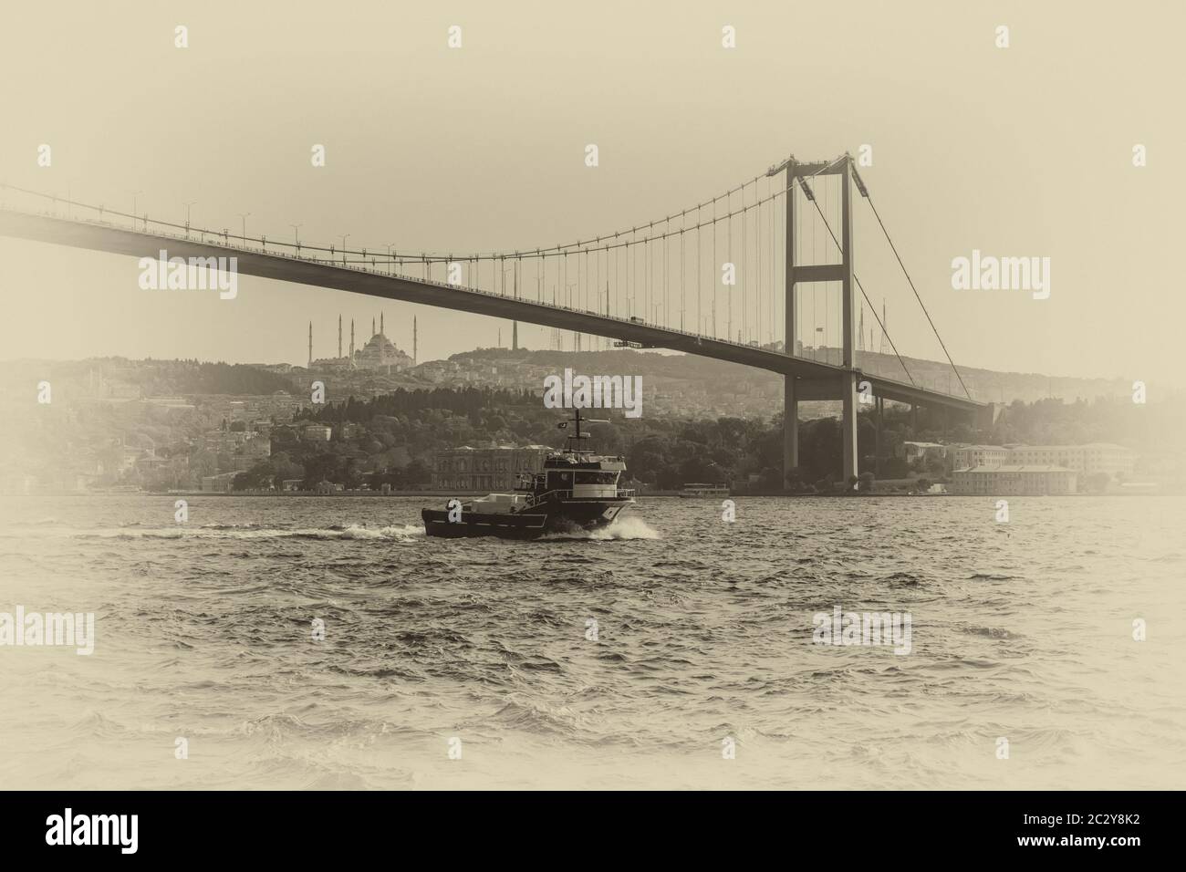 Bosphorus Bridge and a cargo ship, retro style photo, Istanbul Stock ...