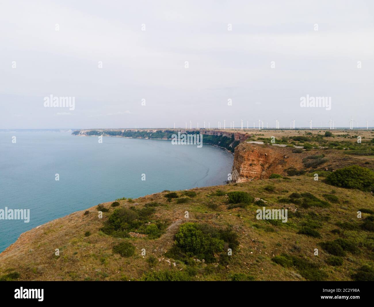 Aerial view landscape of headland sea and wind turbines background ...
