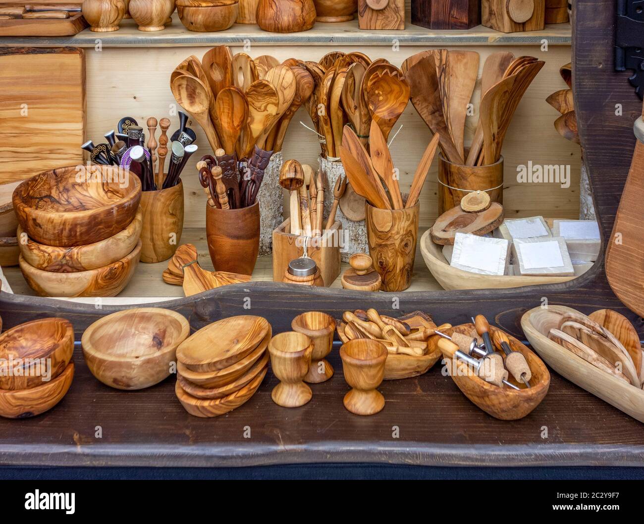 lots of wooden objects at a market stall Stock Photo - Alamy