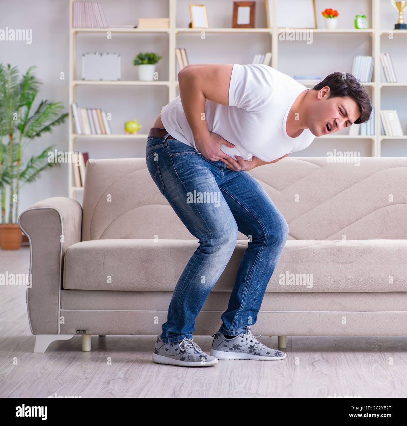 Man suffering from sick stomach and vomiting Stock Photo - Alamy