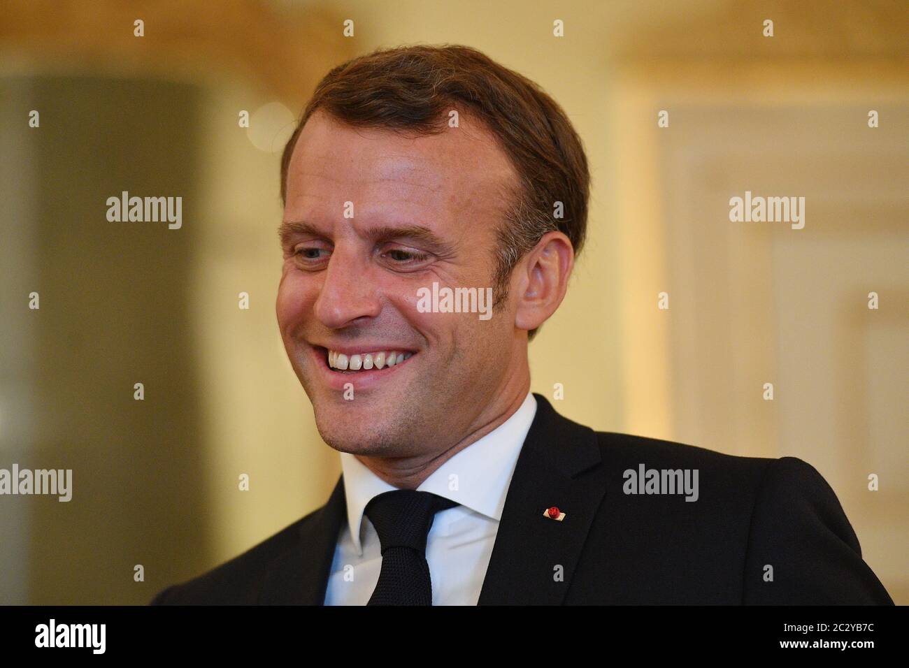 French president Emmanuel Macron looks at historical documents and ...