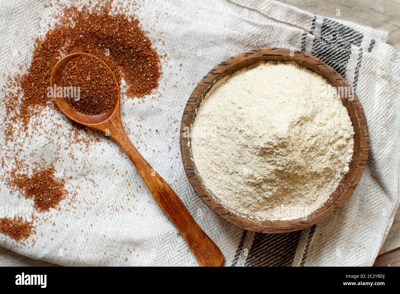 Teff flour in a bowl and teff grain with a spoon top view Stock Photo ...