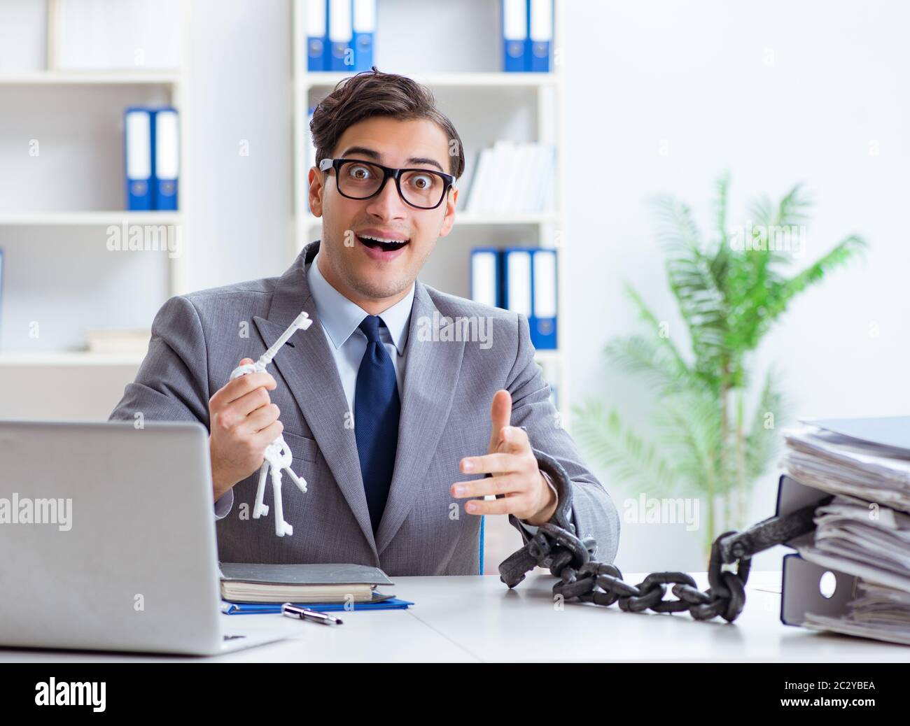 Man chained to desk hi-res stock photography and images - Alamy