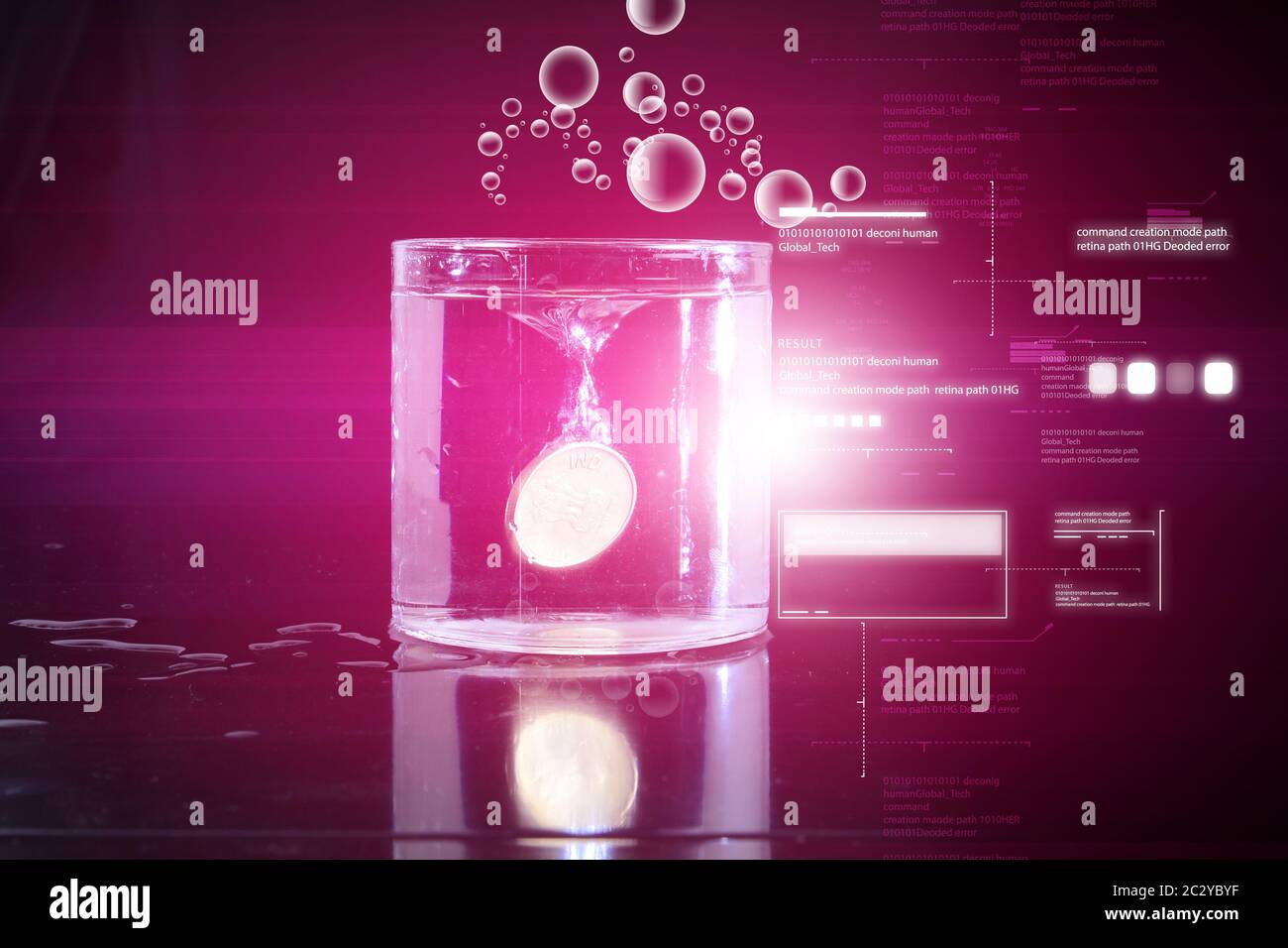 Coin sinking in the glass of water Stock Photo - Alamy