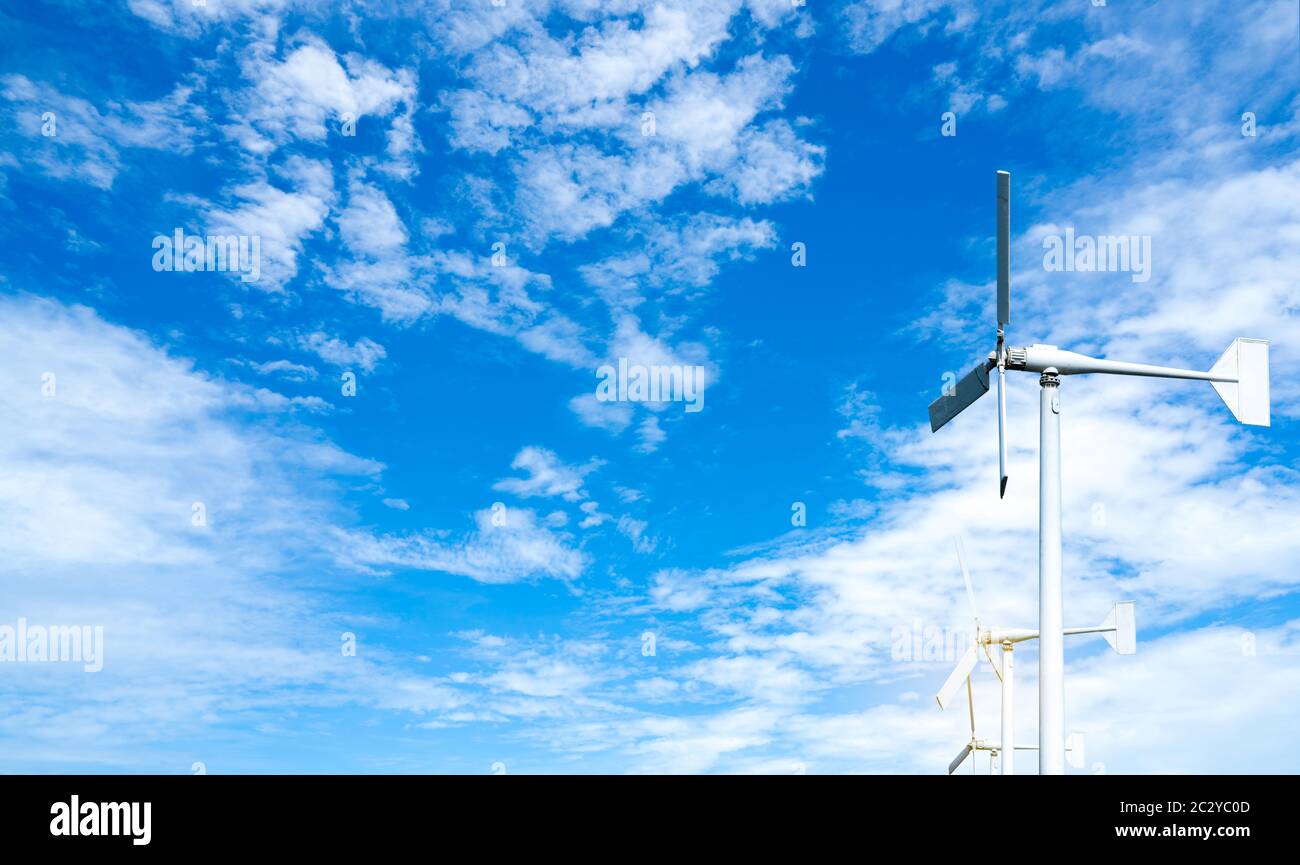 Wind turbine at wind farm on blue sky. Alternative and renewable energy ...