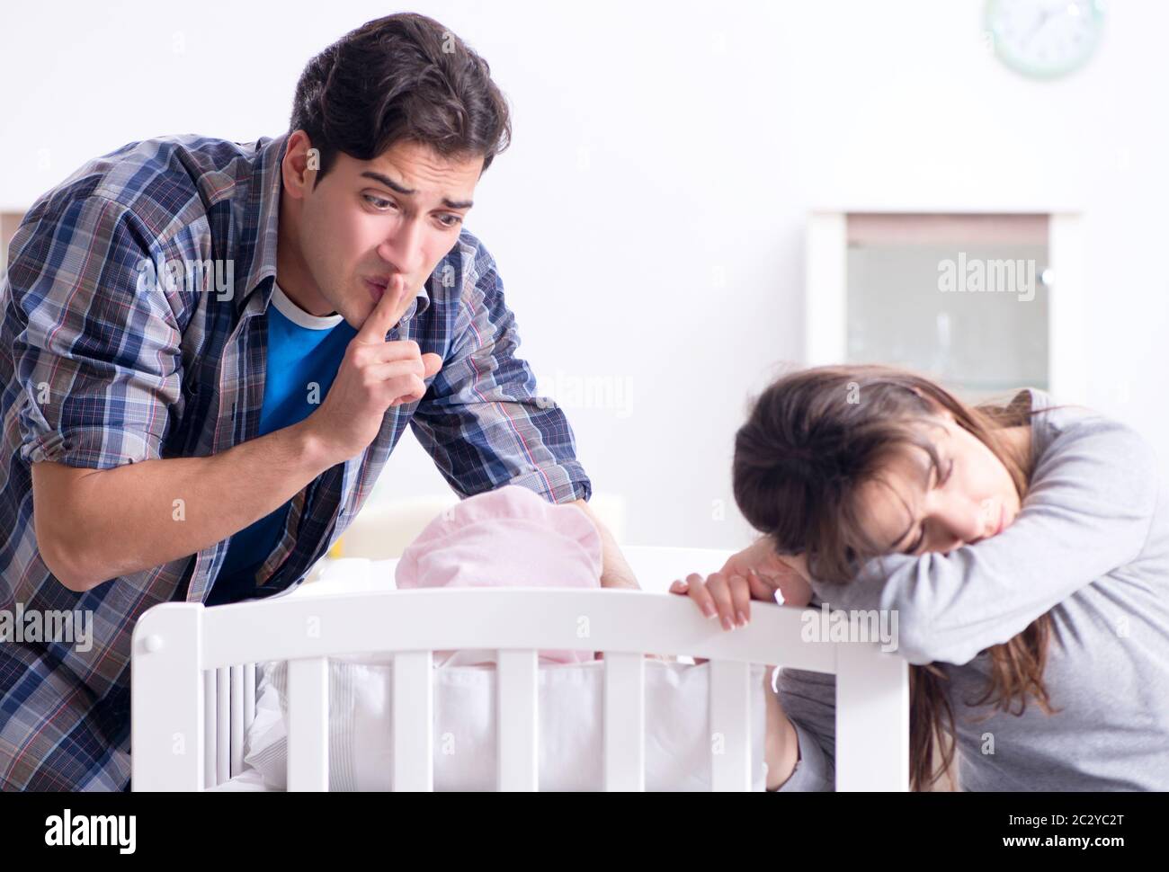 Young dad cannot stand baby crying Stock Photo - Alamy