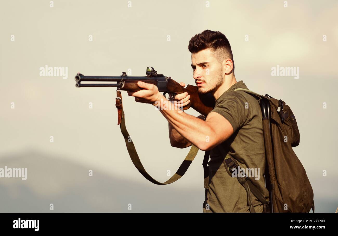 Hunter handsome guy with weapon. Hunter spend leisure hunting. Hunting ...