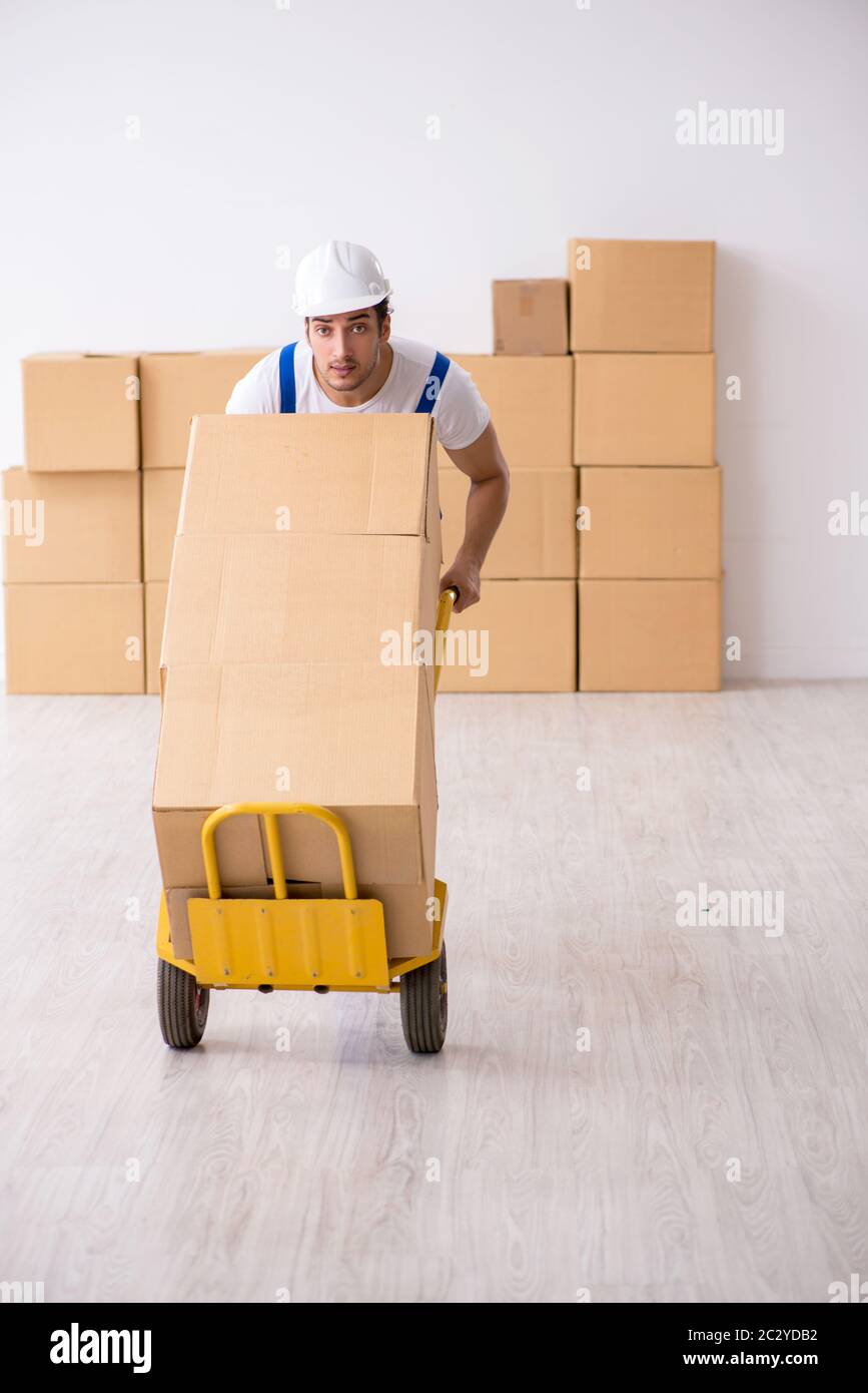 Young male professional mover doing home relocation Stock Photo - Alamy