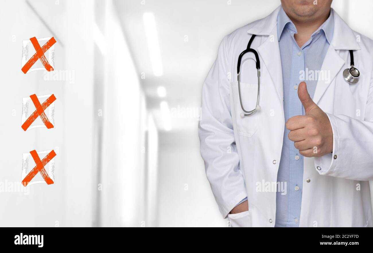 Checkbox concept and doctor with thumbs up Stock Photo - Alamy