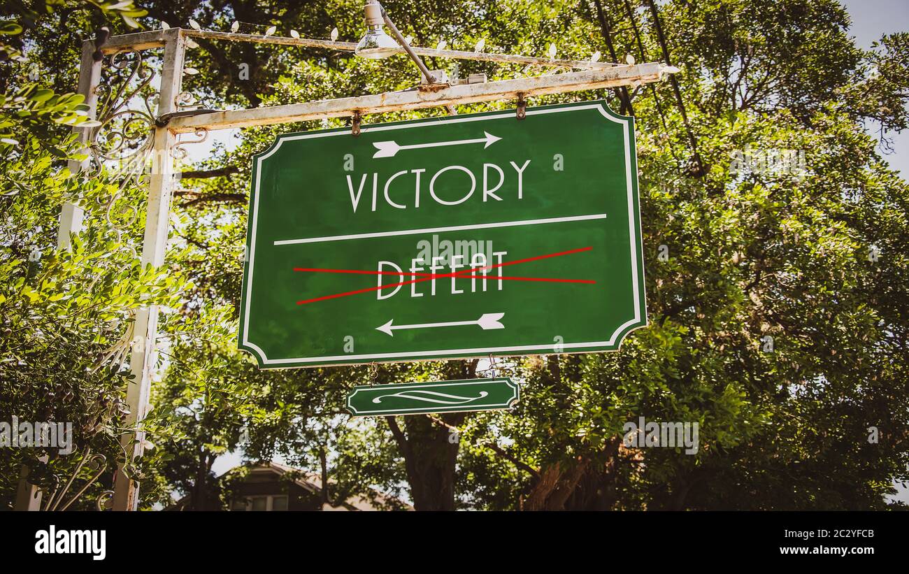 Street Sign Victory versus Defeat Stock Photo - Alamy