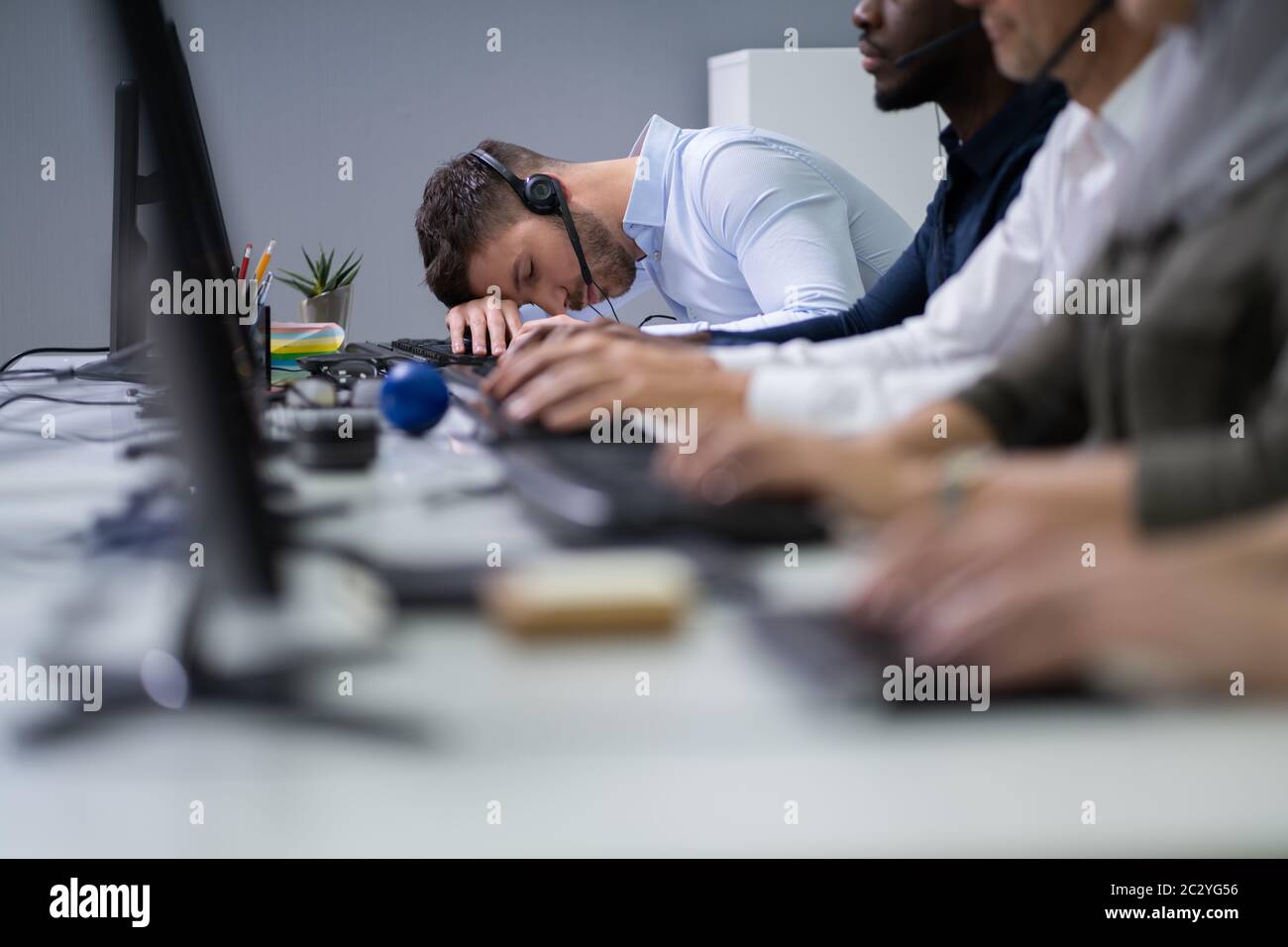 Office workers sleeping at desk hi-res stock photography and images - Alamy