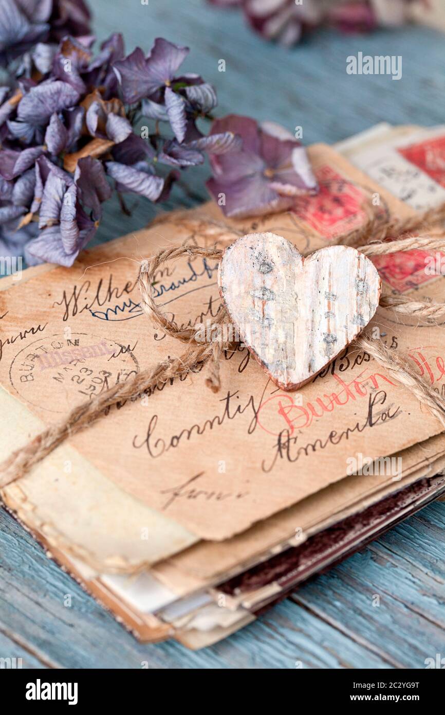 vintage style still life with bundle of old handwritten letters, heart ...