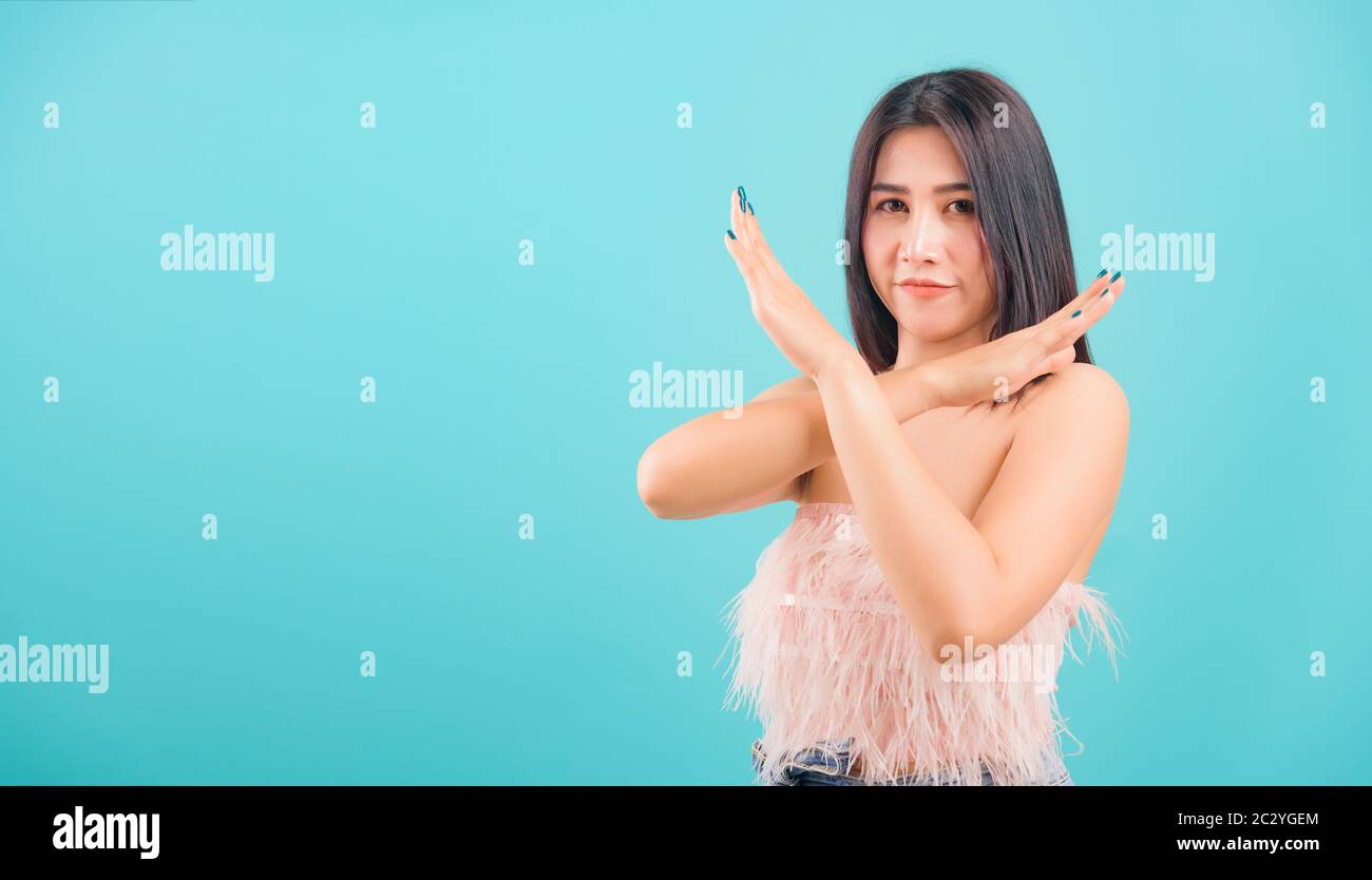 Asian beautiful woman her showing say no hand sign looking to camera on ...