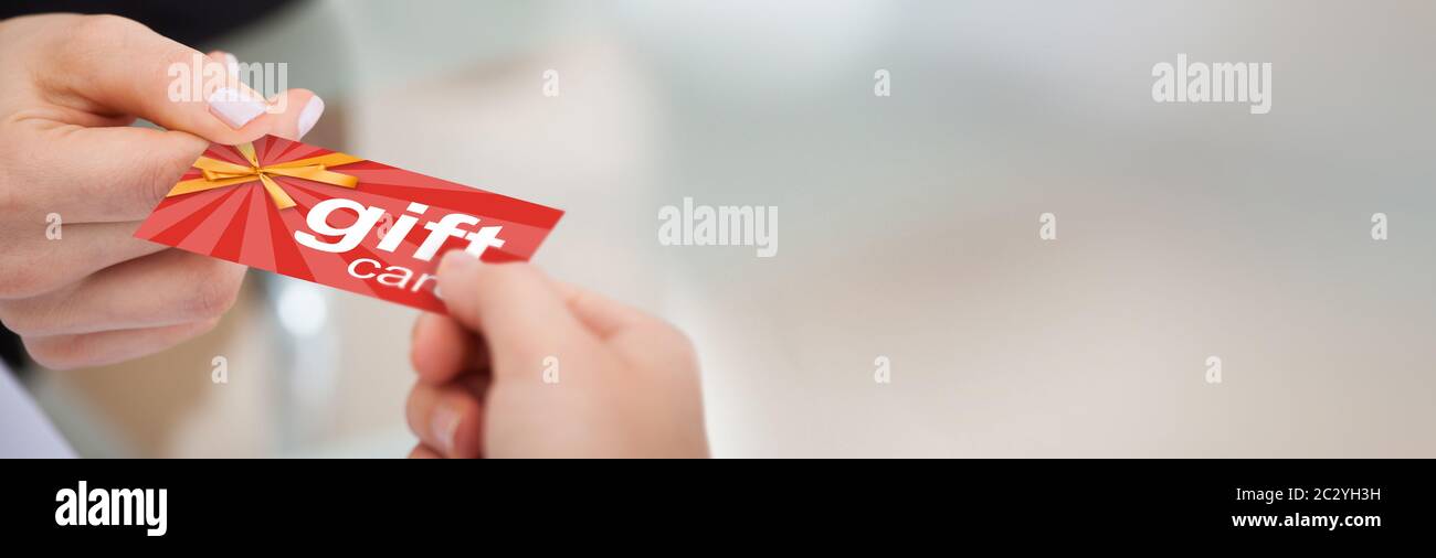 Close-up Of Person Hand Giving Gift Card To Another Person Stock Photo ...