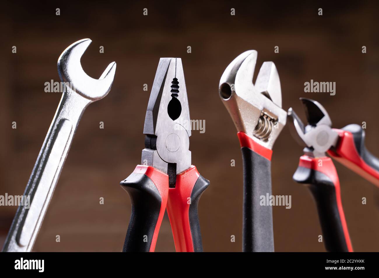 Tools including Pliers, Monkey Spanner And Wrench On Wooden Background ...