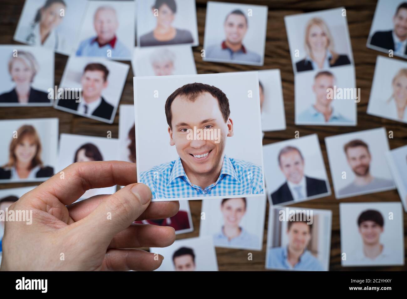 Close-up Of A Businessman Making Candidate Selection Over The Desk At ...