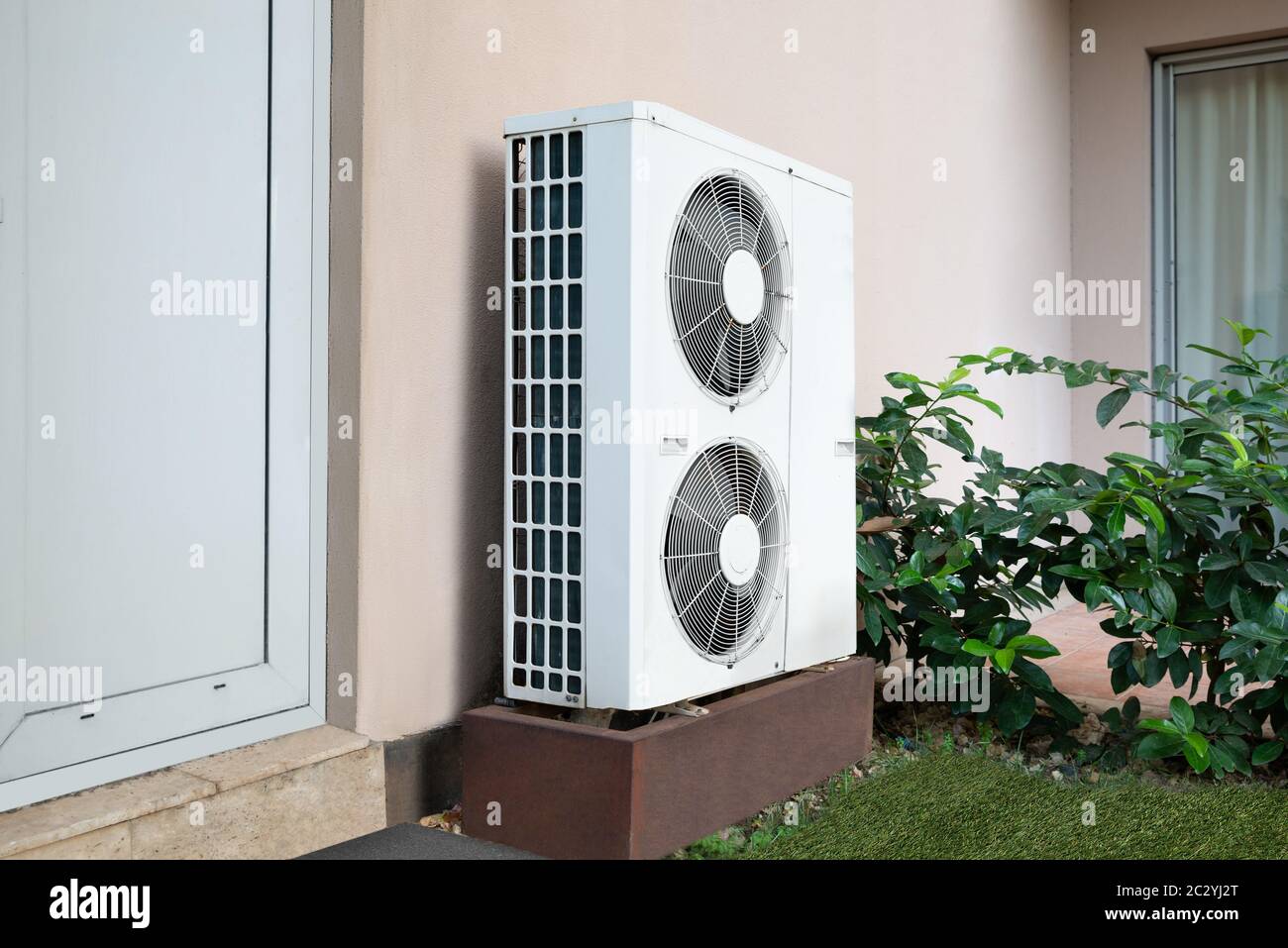Air Conditioner Unit Standing Outside Of The House Stock Photo - Alamy