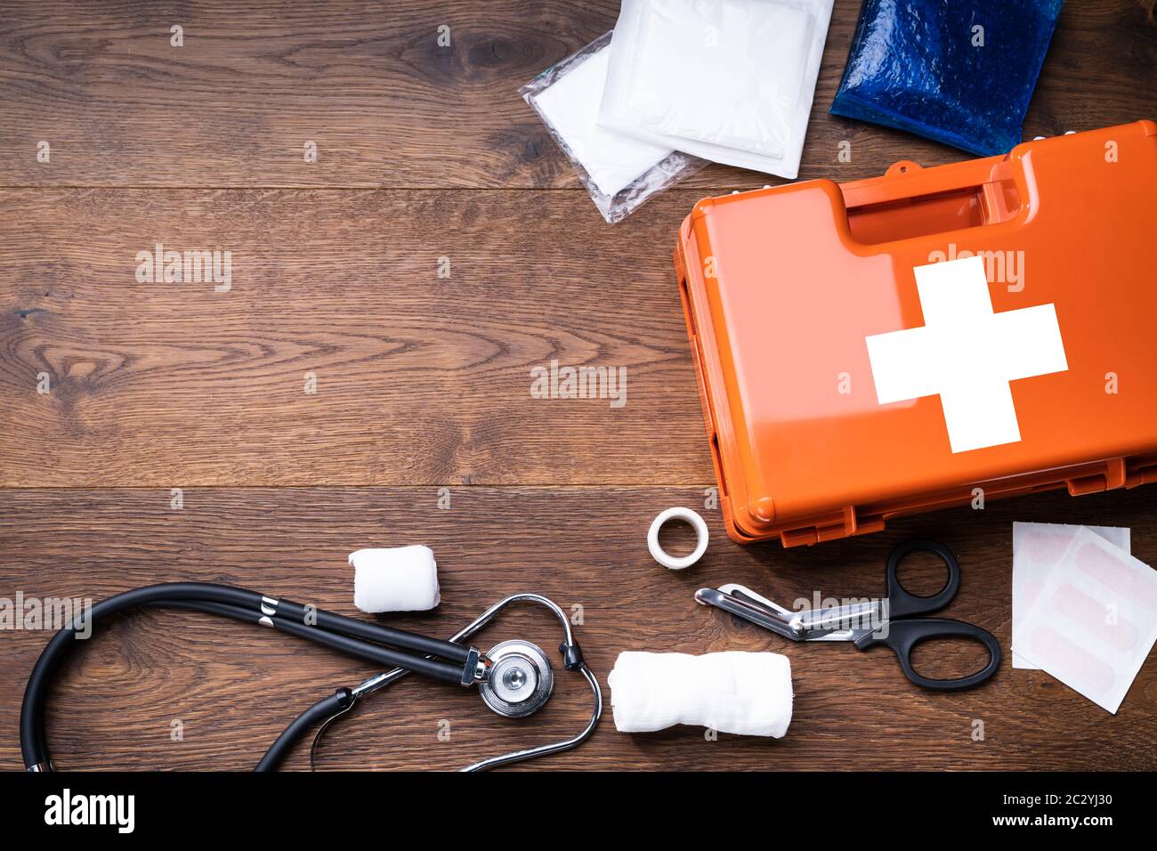 First Aid Kit With Medical Equipment On Wooden Background Stock Photo ...