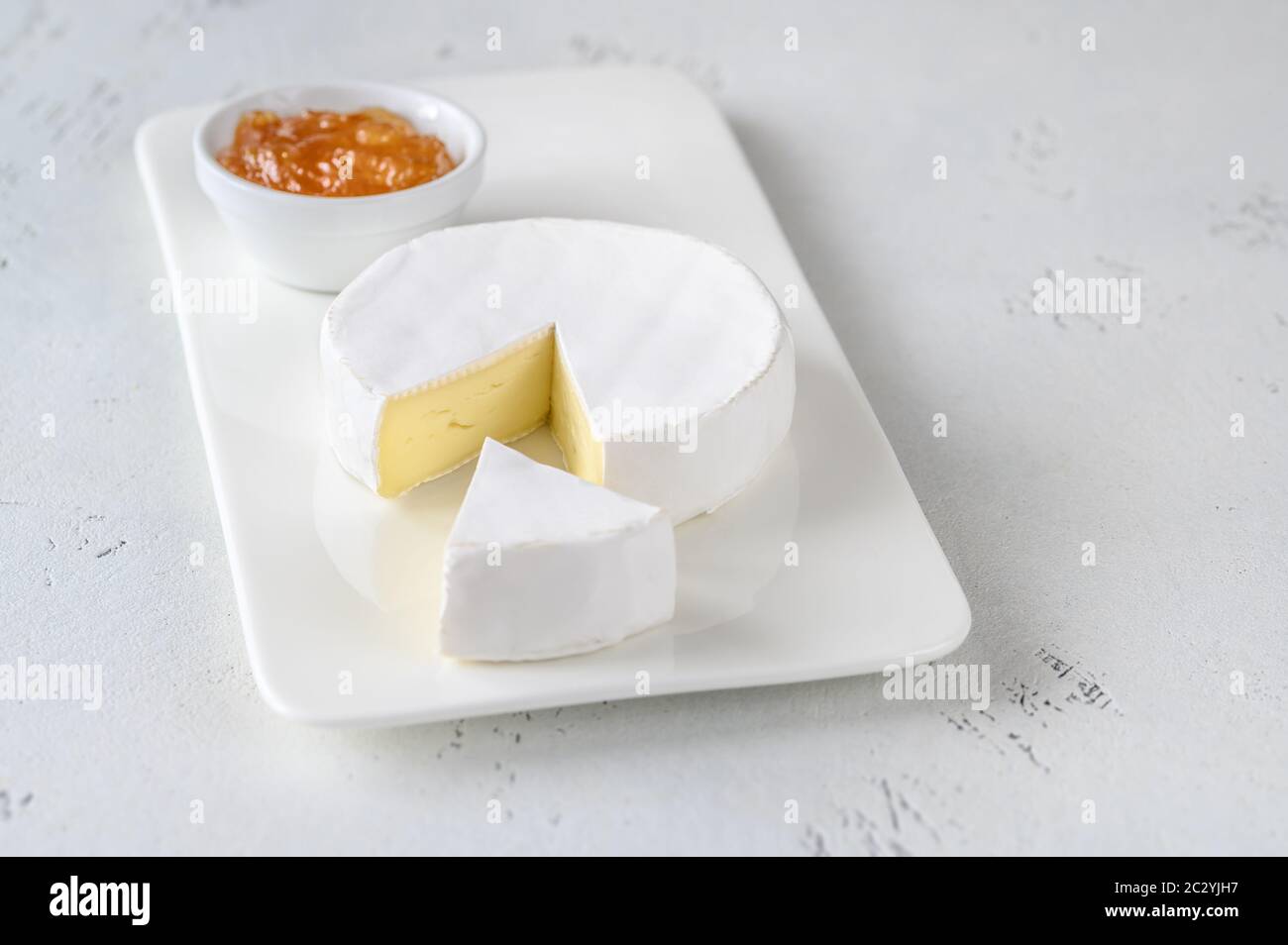 Camembert cheese head on cutting hi-res stock photography and images ...