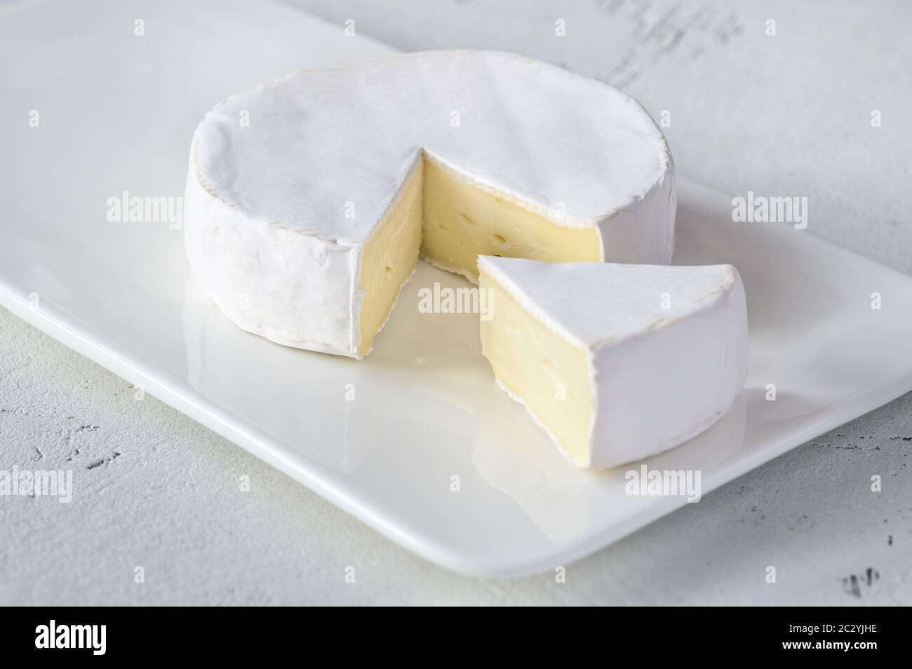 Camembert cheese head on cutting hi-res stock photography and images ...
