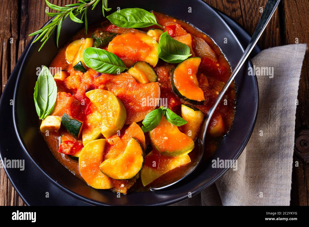 zucchini vegetarian ratatouille with tomato sauce and herbs Stock Photo ...